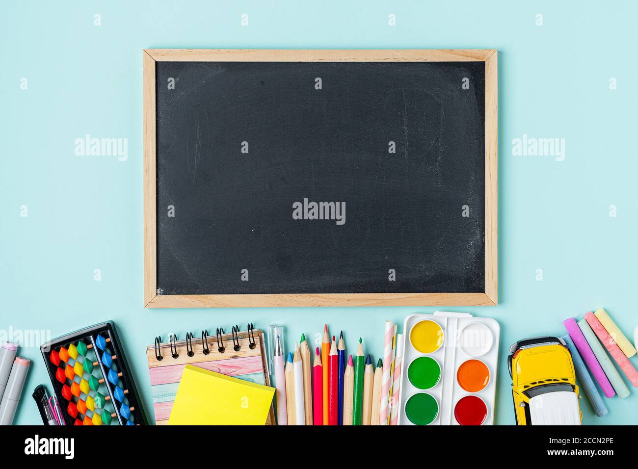 Concept Back To School Color Chalk Pencil Notebook Stationery on blue ...