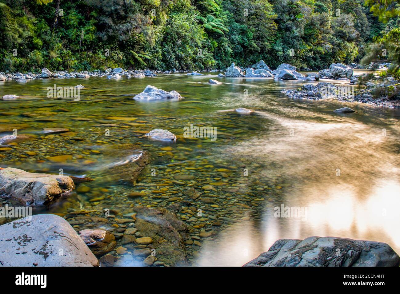 Transparent clean and clear Pakuratahi river water flowing through ...