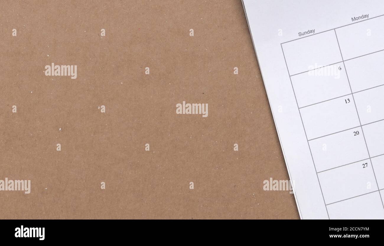 Calendar on brown cardboard paper, copy space. Business meeting ...