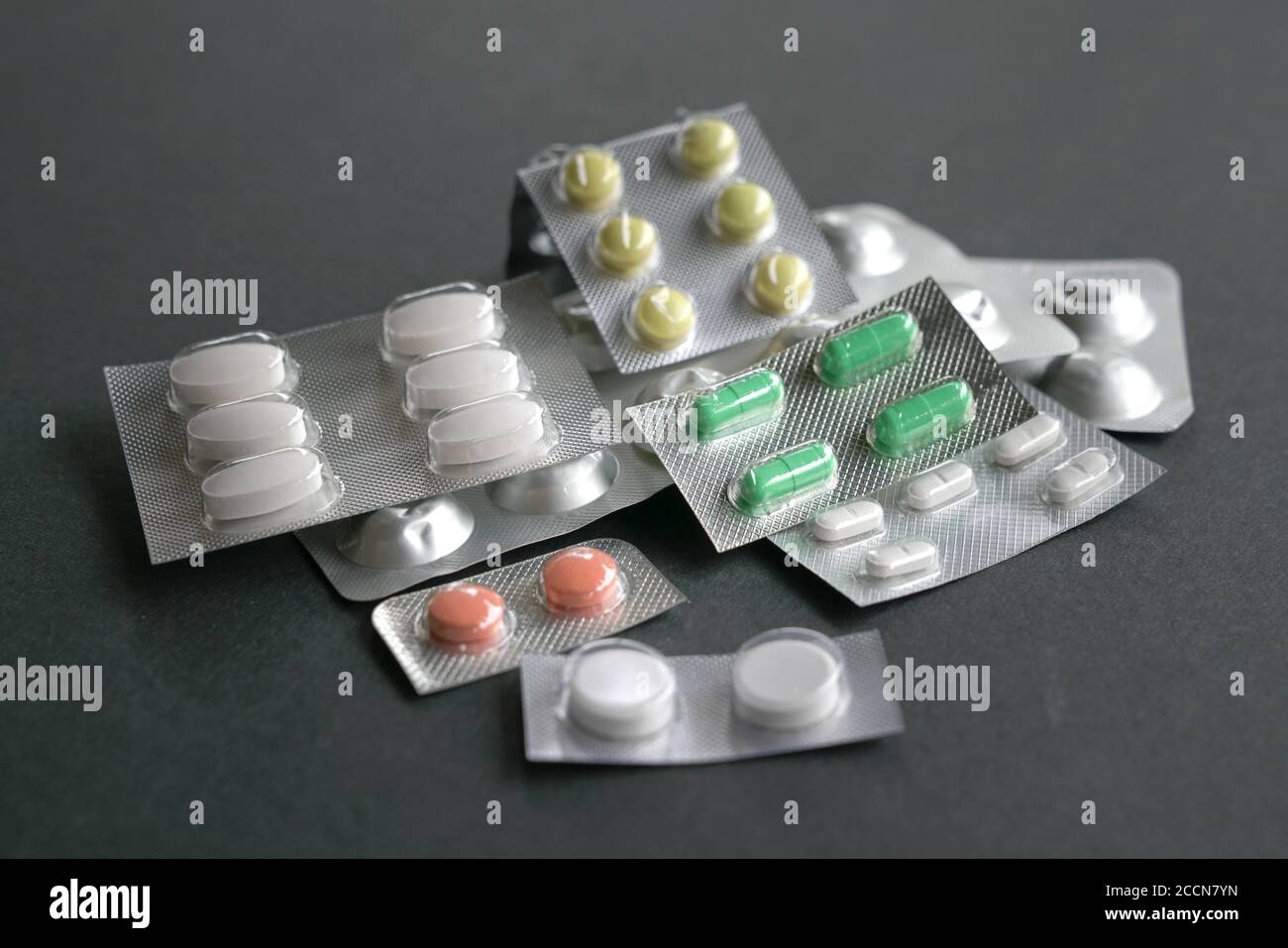 Package of medicine in tablet and pills form, in various colors ...