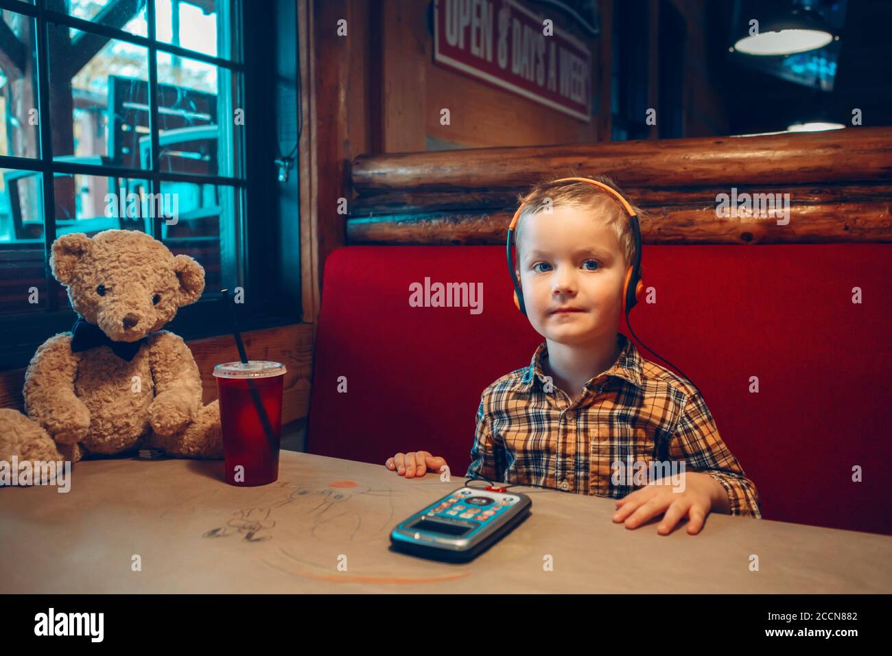 Cute adorable funny little boy toddler playing digital toy cell phone ...