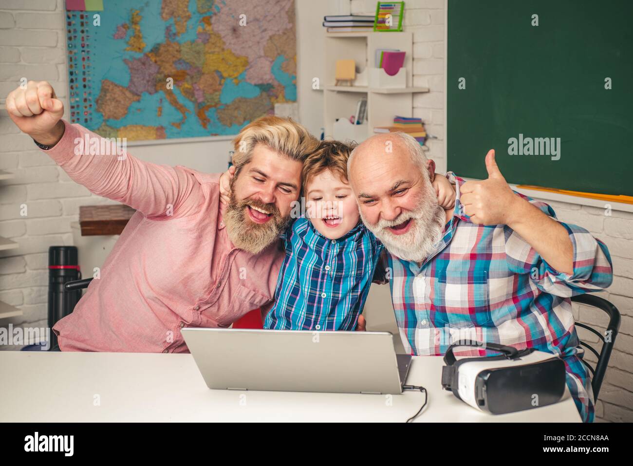 Happy three generations of men playing computer games. Man family. Man ...
