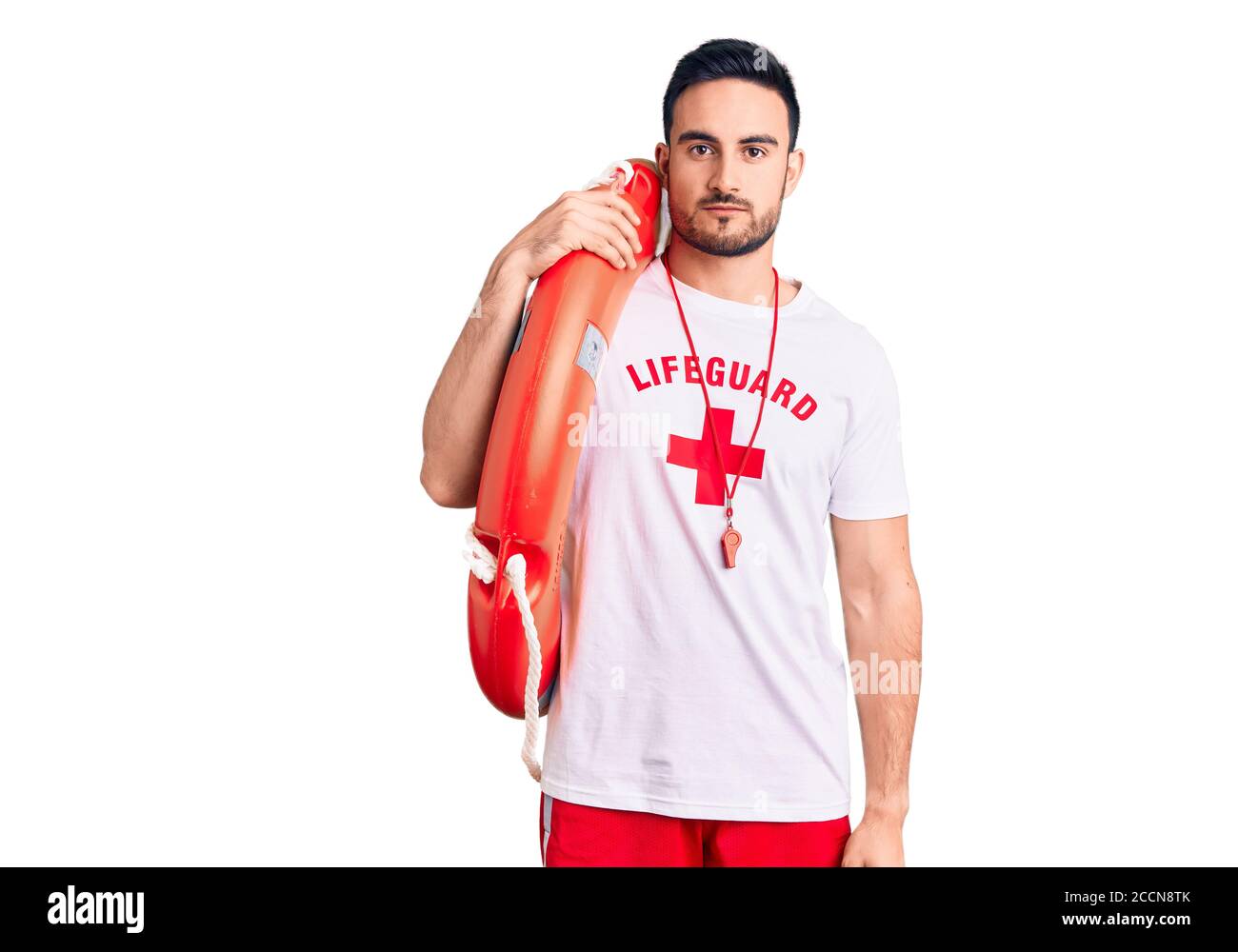 Young handsome man wearing lifeguard uniform holding float thinking ...