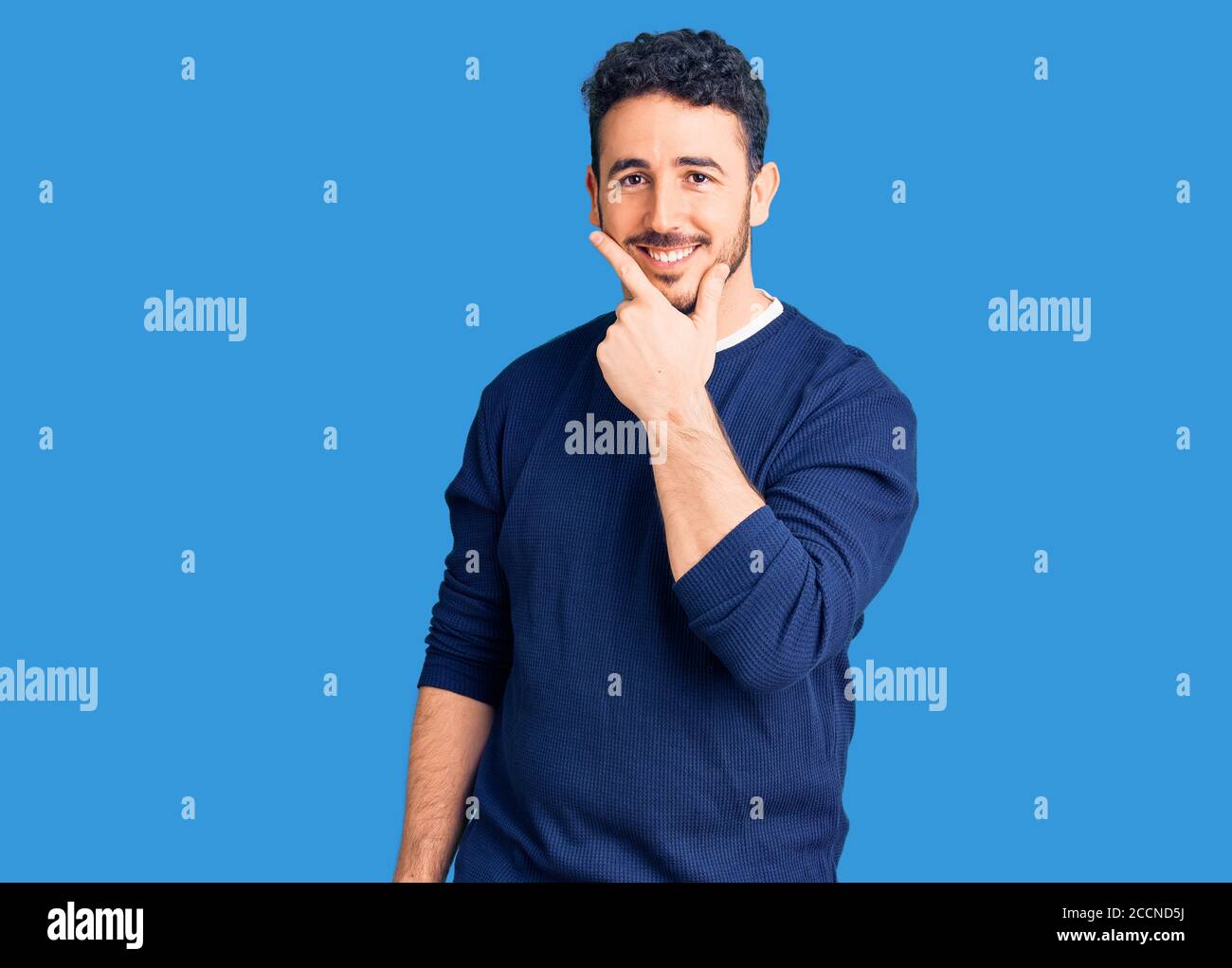 Young hispanic man wearing casual clothes looking confident at the ...