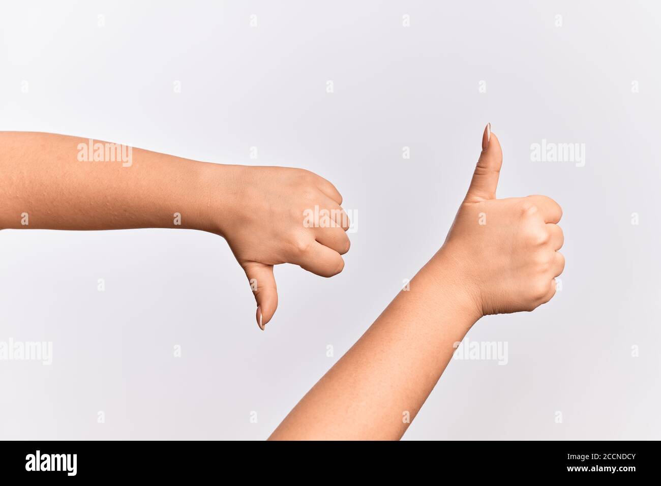Hand of caucasian young woman showing disagree and agreement with ...