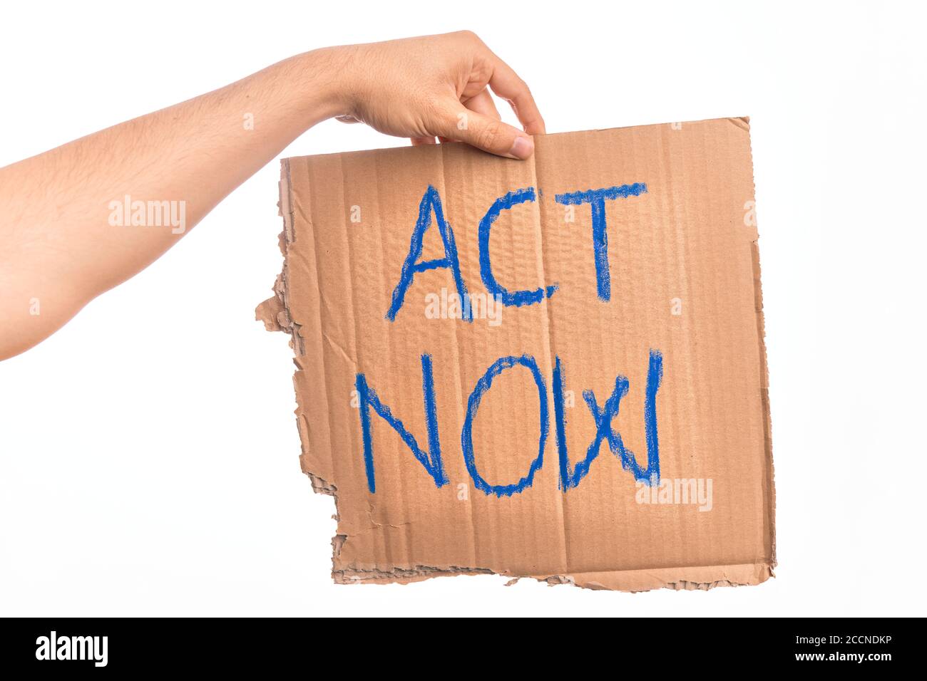 Cardboard banner ACT NOW text, take action now message over isolated ...