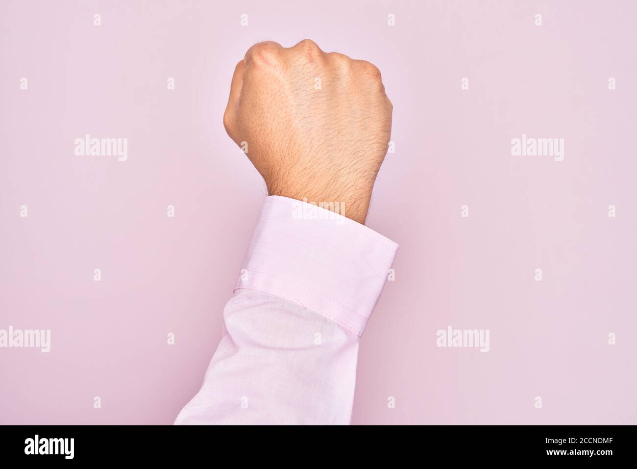 Hand of caucasian young man showing fingers over isolated pink ...