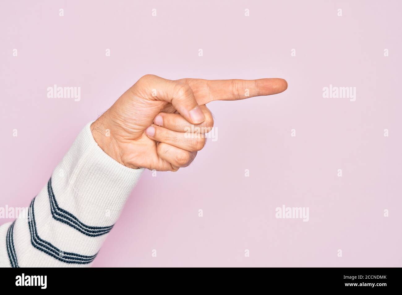 Hand of caucasian young man showing fingers over isolated pink ...