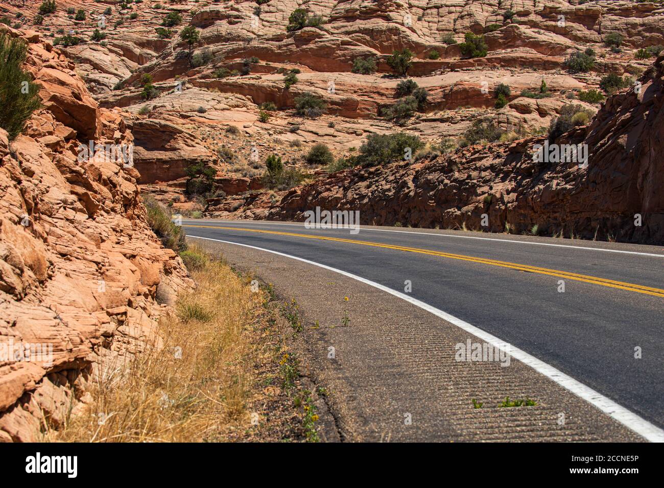 Road against the high rocks. Western countryside highway during hot ...