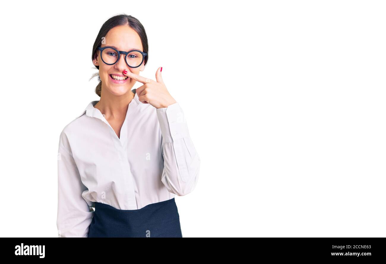 Beautiful brunette young woman wearing professional waitress apron ...