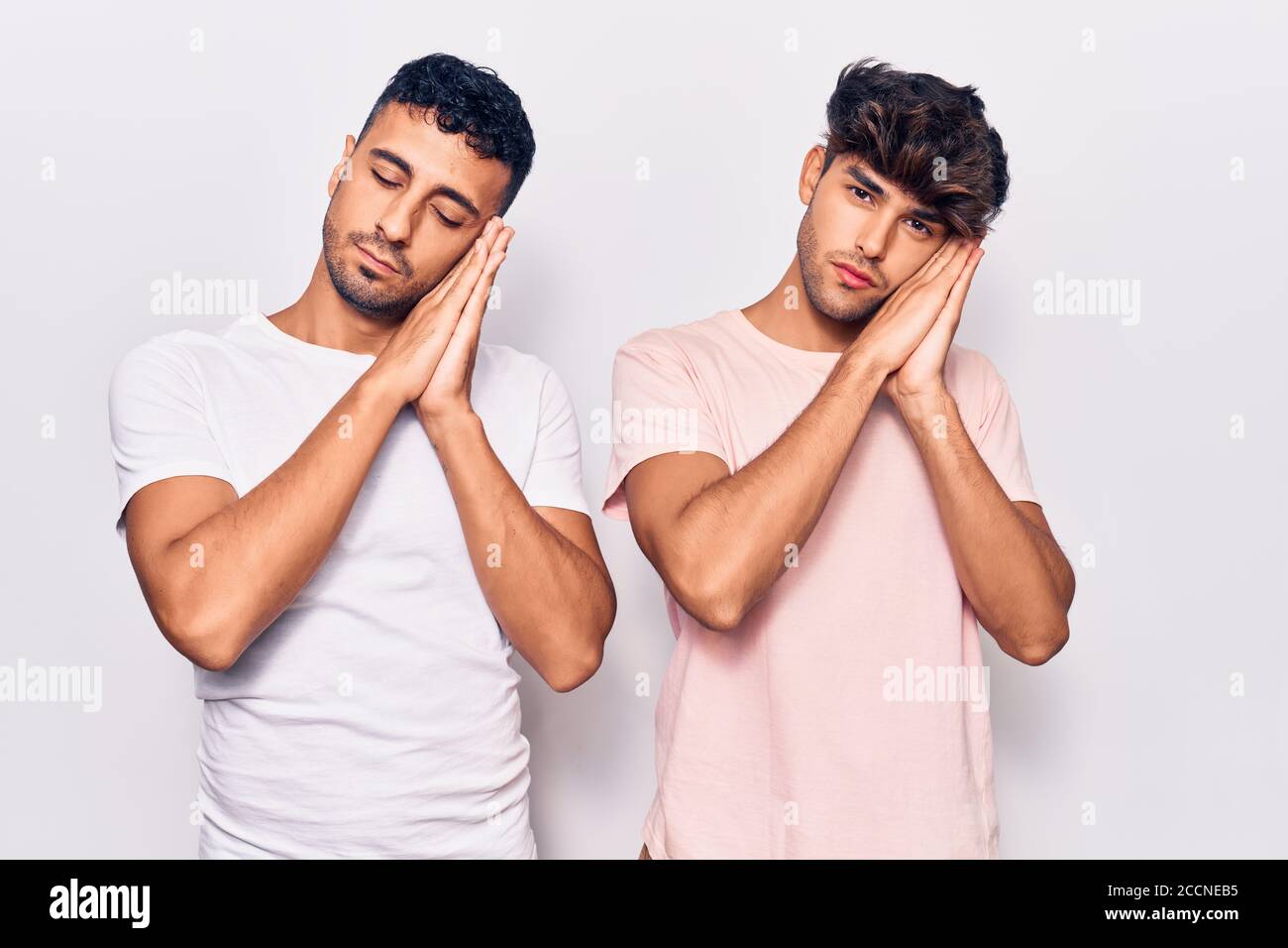 Young gay couple wearing casual clothes sleeping tired dreaming and ...