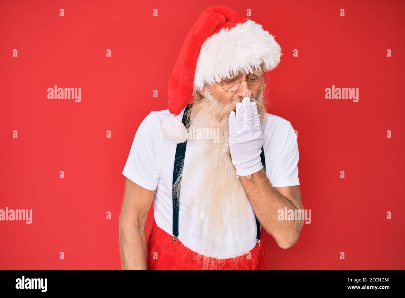 Old senior man with grey hair and long beard wearing white t-shirt and ...