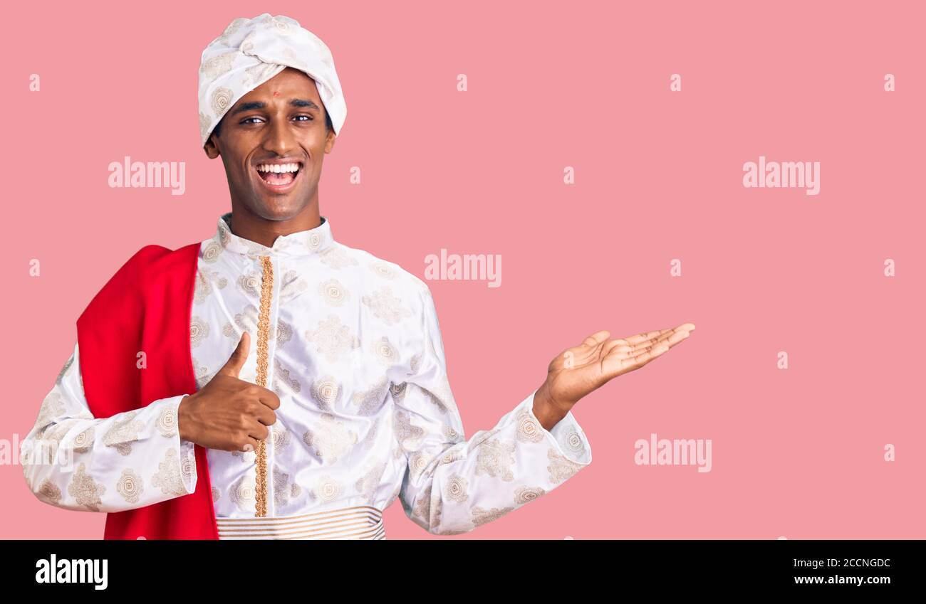 African handsome man wearing tradition sherwani saree clothes showing ...