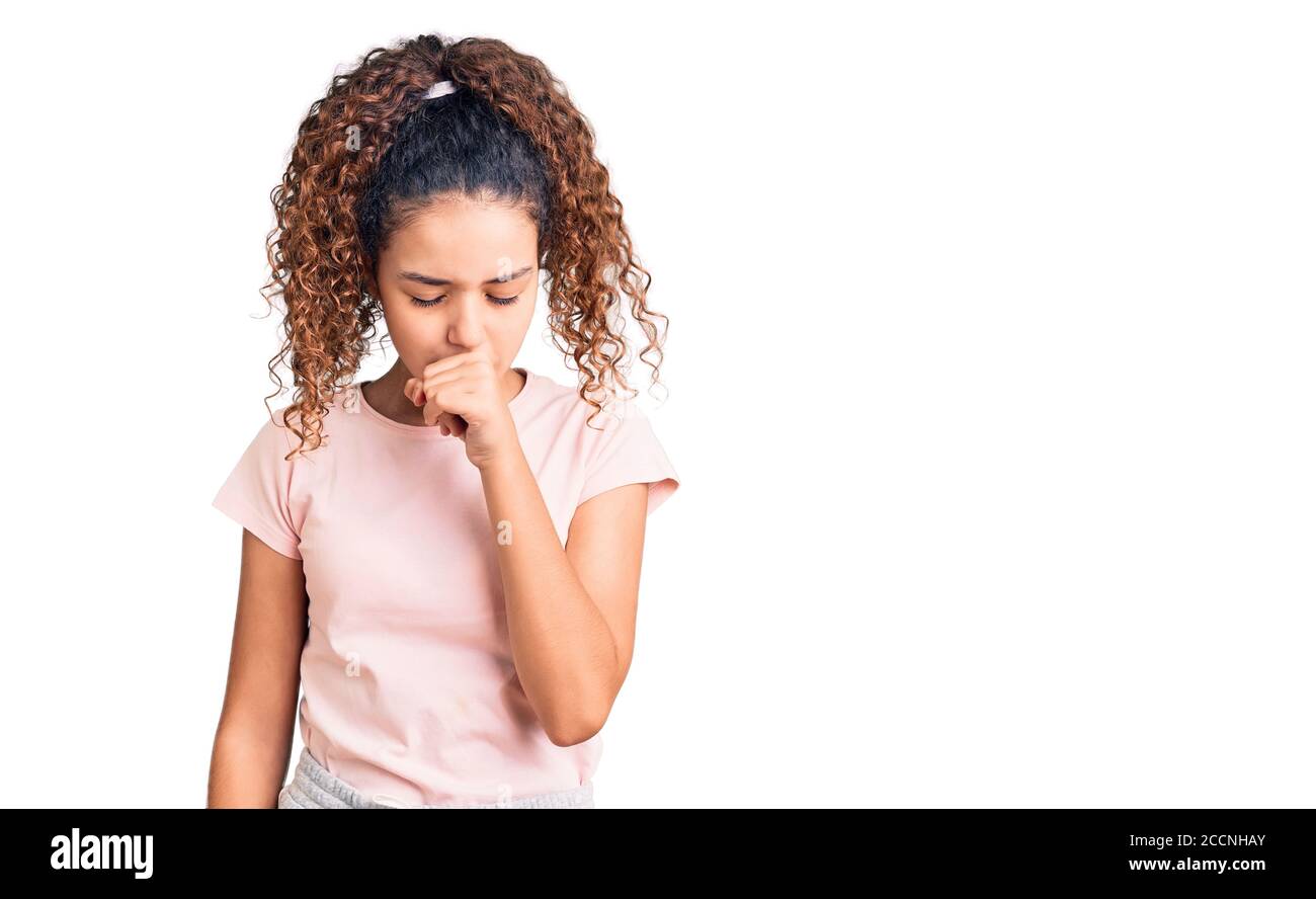 Beautiful kid girl with curly hair wearing casual clothes feeling ...