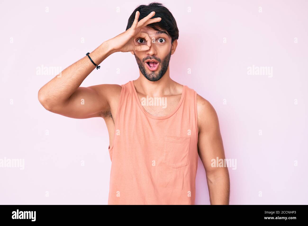 Handsome hispanic man wearing casual clothes doing ok gesture shocked ...
