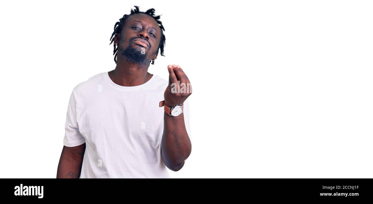 Young african american man with braids wearing casual white tshirt ...