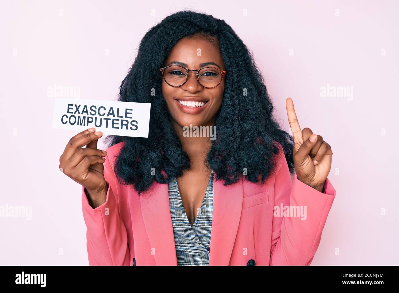 Beautiful african woman holding exascale computers banner smiling with ...