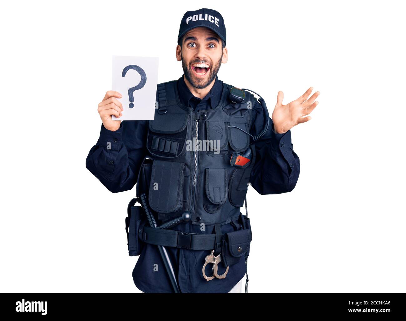 Young handsome man with beard wearing police uniform holding question ...