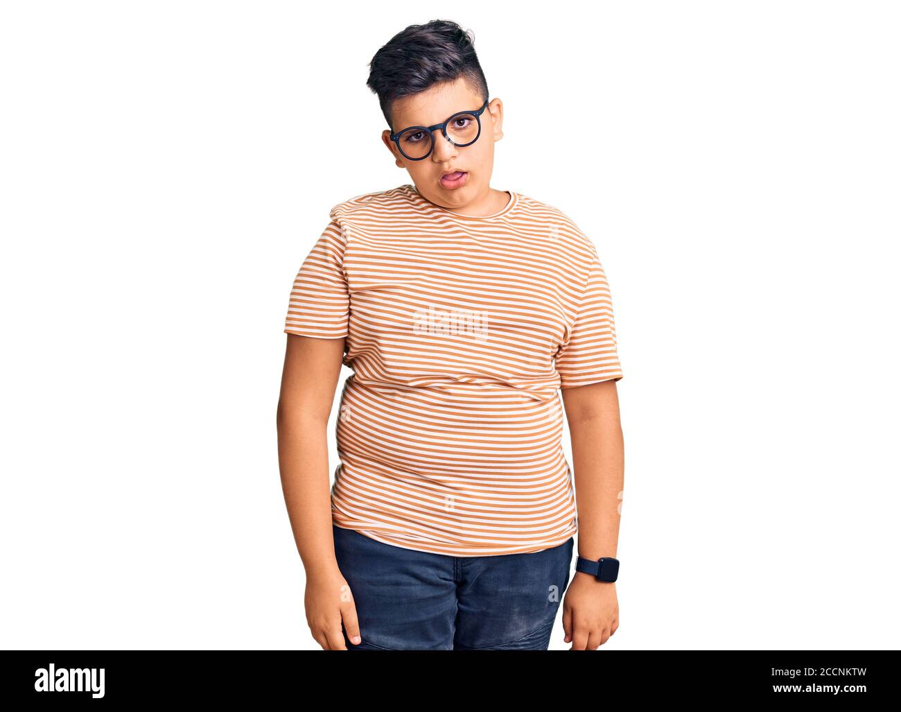 Little boy kid wearing casual clothes and glasses in shock face ...