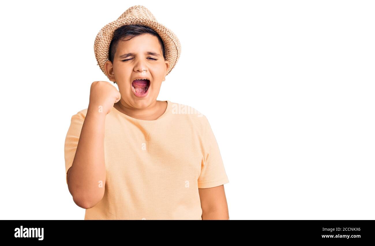 Little boy kid wearing summer hat and hawaiian swimsuit angry and mad ...