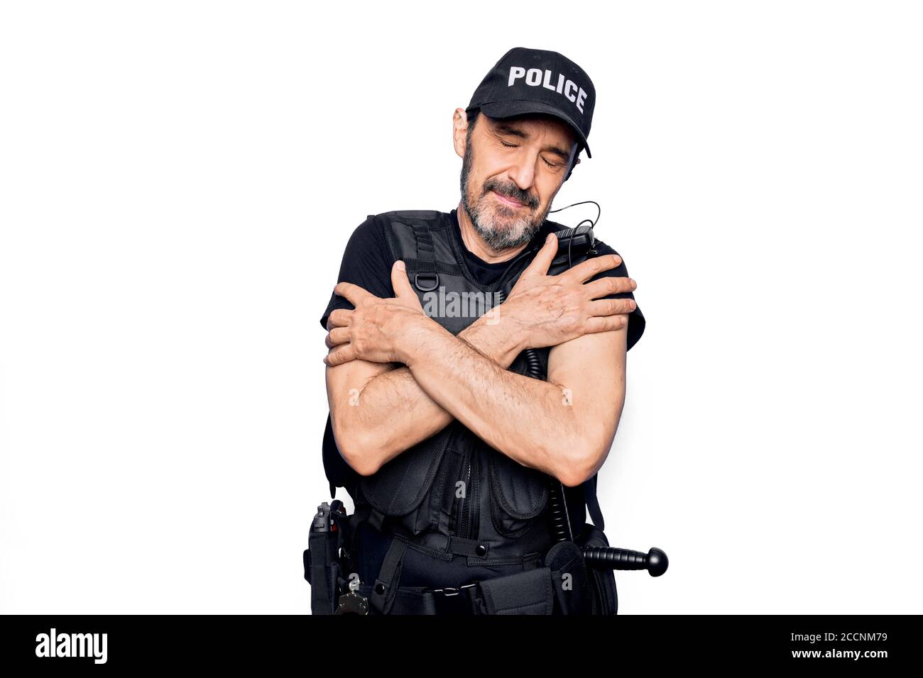 Middle age policeman wearing police uniform and bulletproof vest over ...