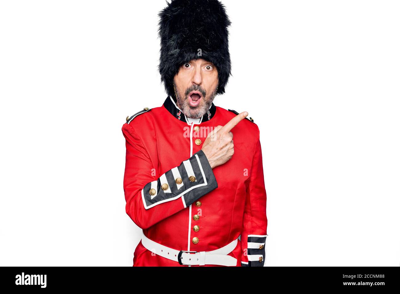 Middle age handsome wales guard man wearing traditional uniform over ...