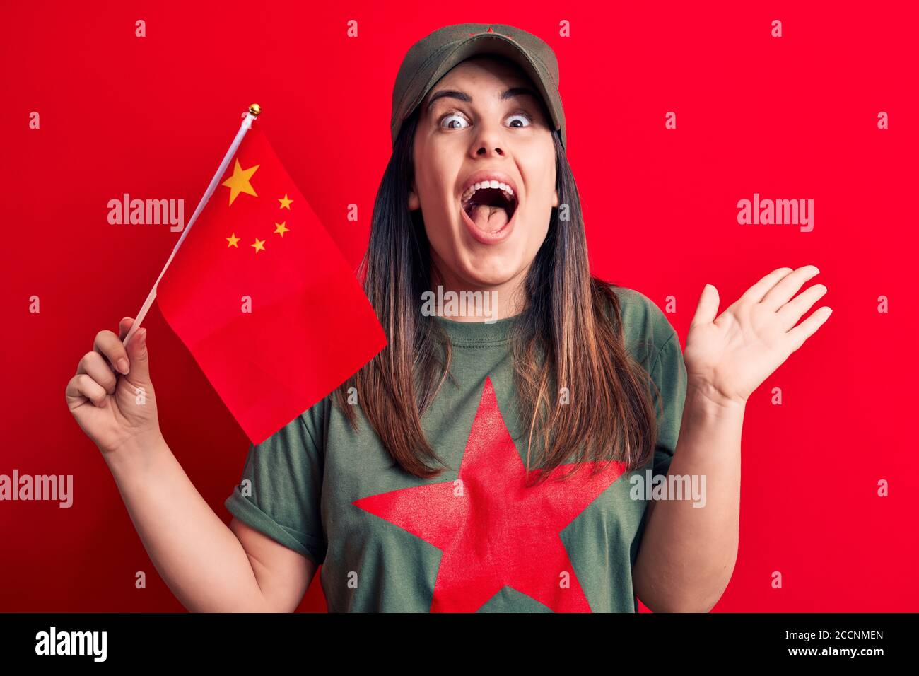 Beautiful patriotic woman wearing t-shirt with red star communist ...
