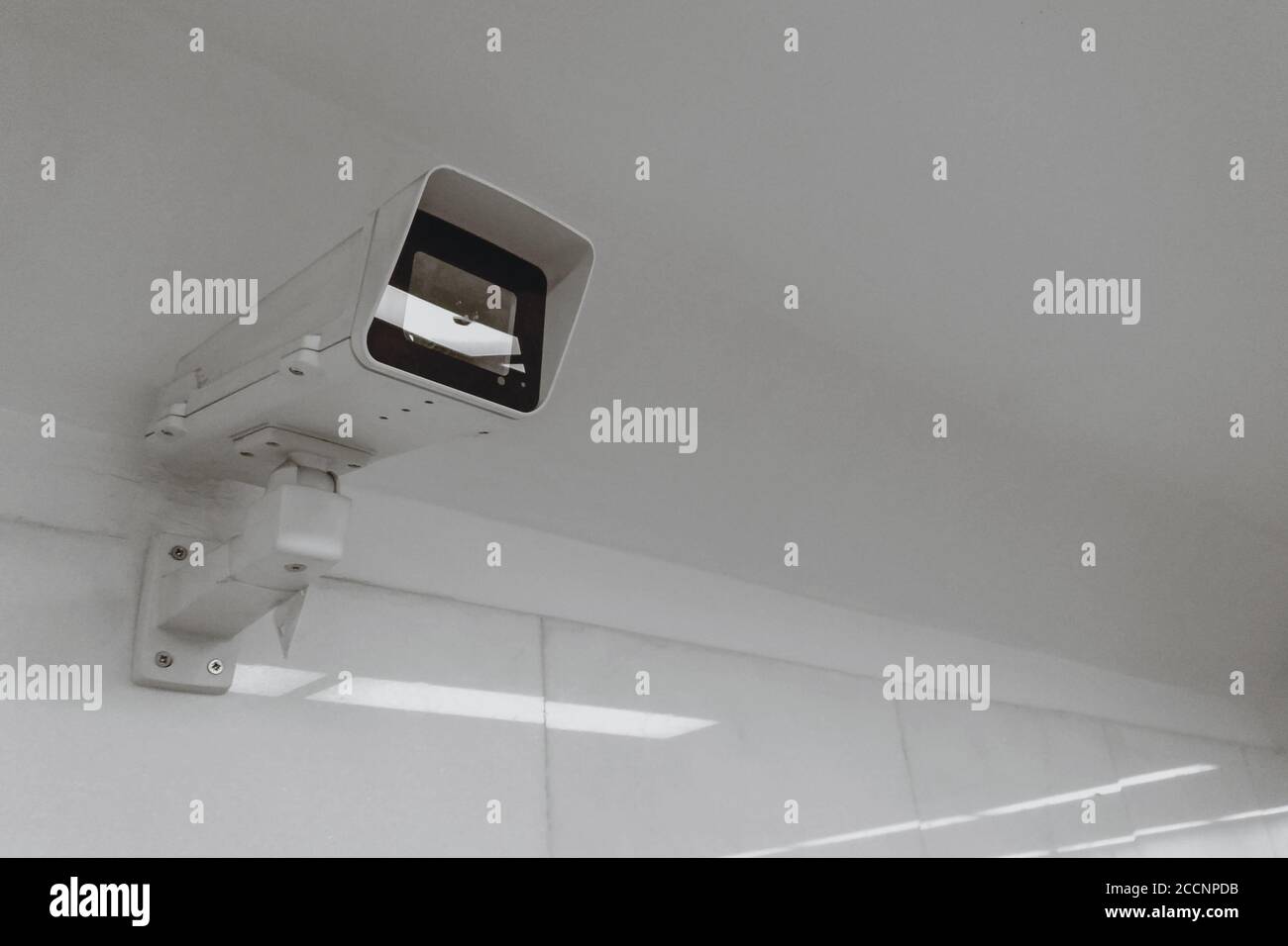 city video surveillance system - security camera under ceiling, side ...