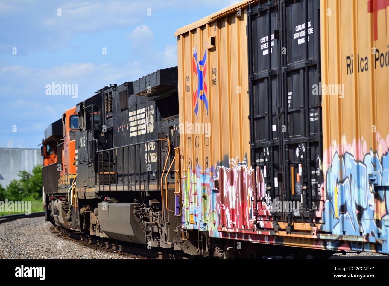 Mendota, Illinois, USA. Three locomotives, including and off-road power Norfolk Southern unit ...