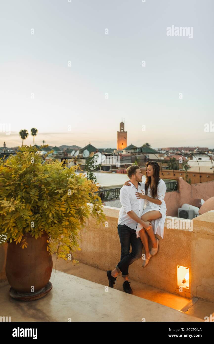 Romantic evening for couple in honeymoon. Rooftop terrace with view of ...