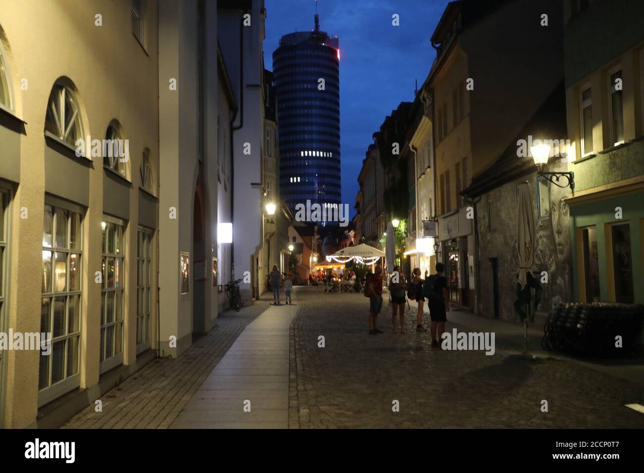 Jena, Germany. 21st Aug, 2020. Lamps light up in Wagnergasse in the old ...