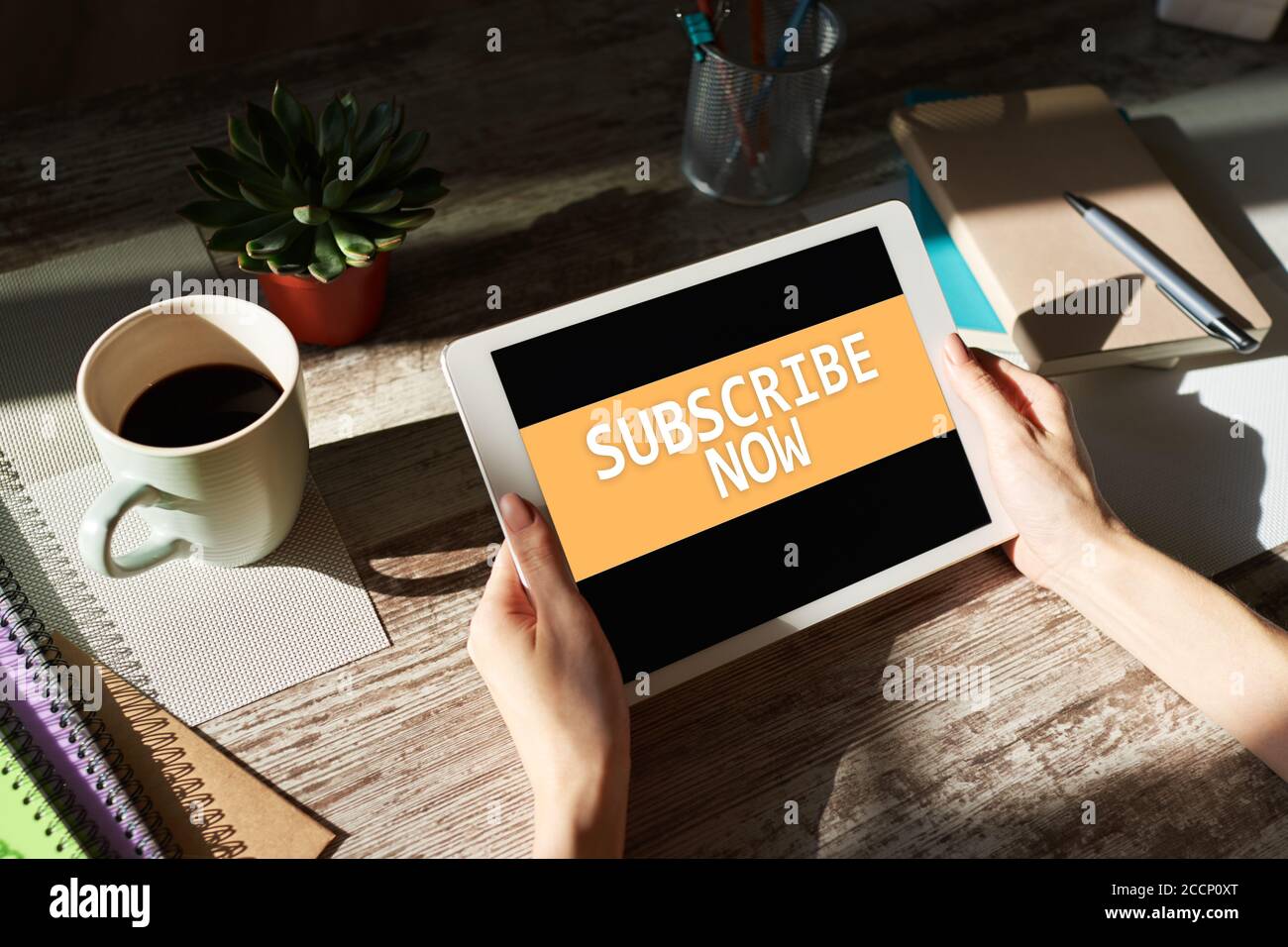 Subscribe button on device screen. Internet and digital marketing ...