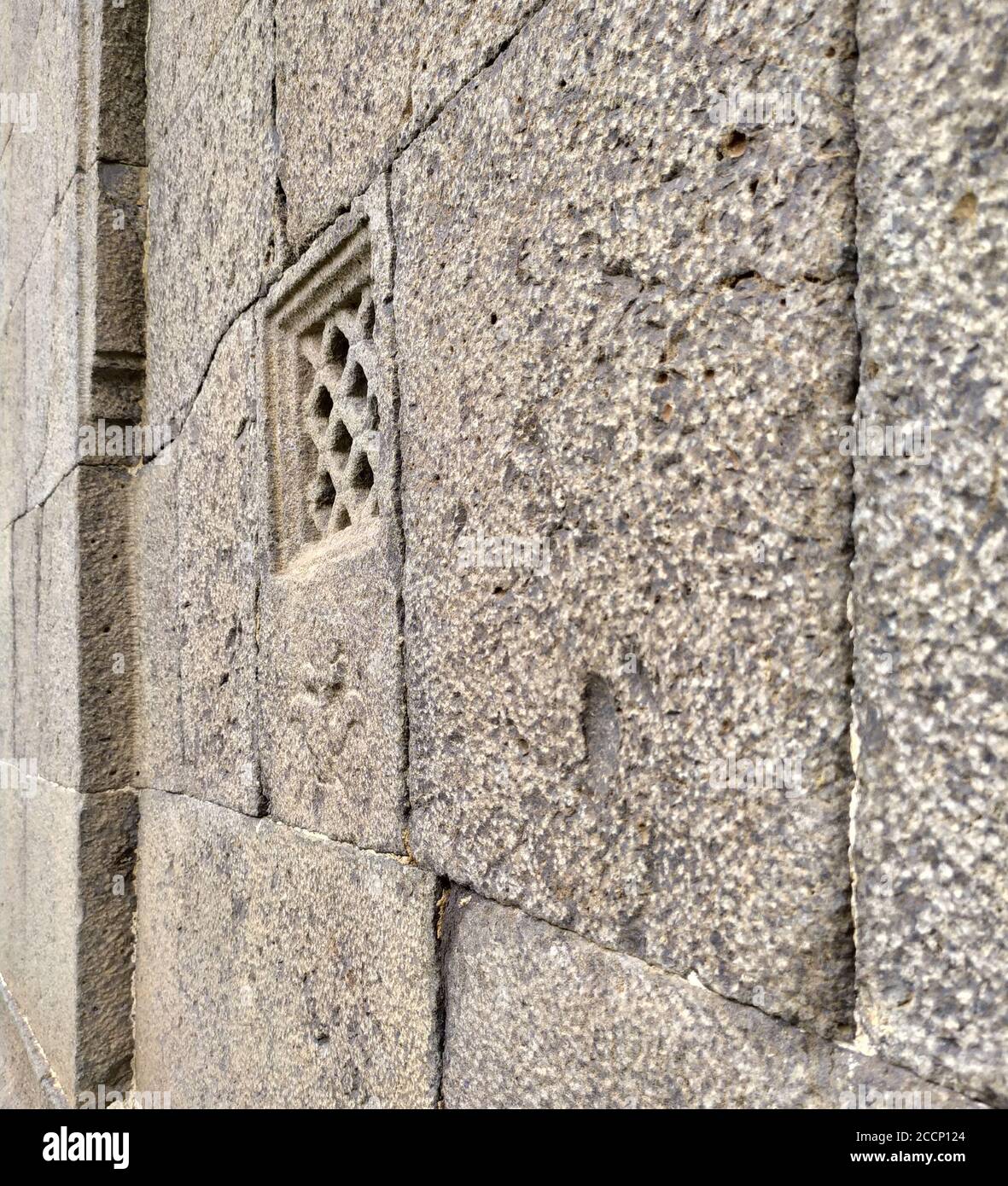 Closeup of window of historical monument built with high weighed stones ...
