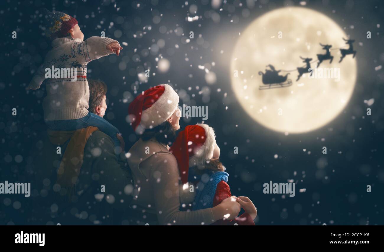 Merry Christmas and happy holidays! Cute little children with mom and ...