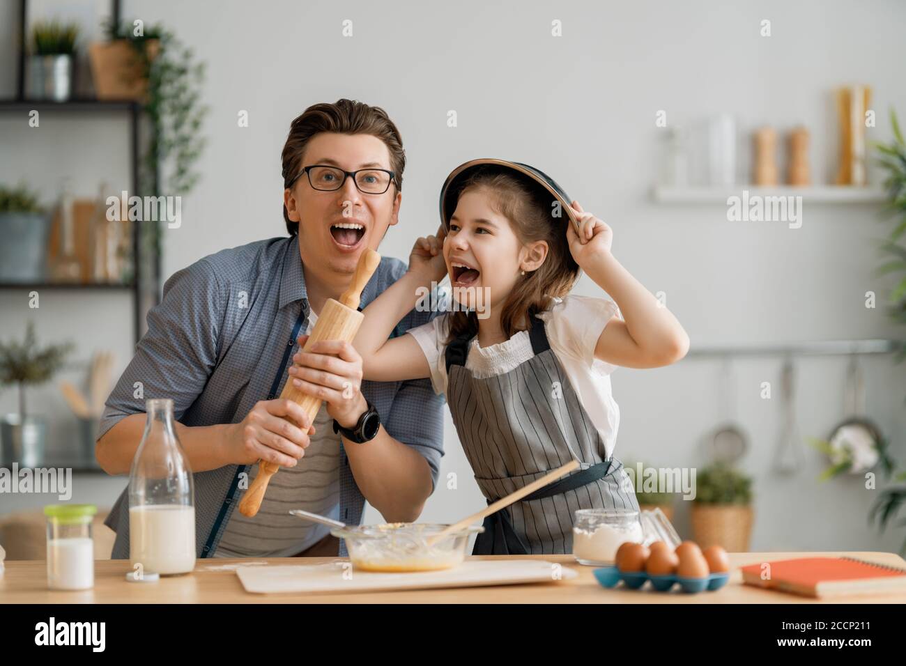 Happy loving family are preparing bakery together. Father and child ...
