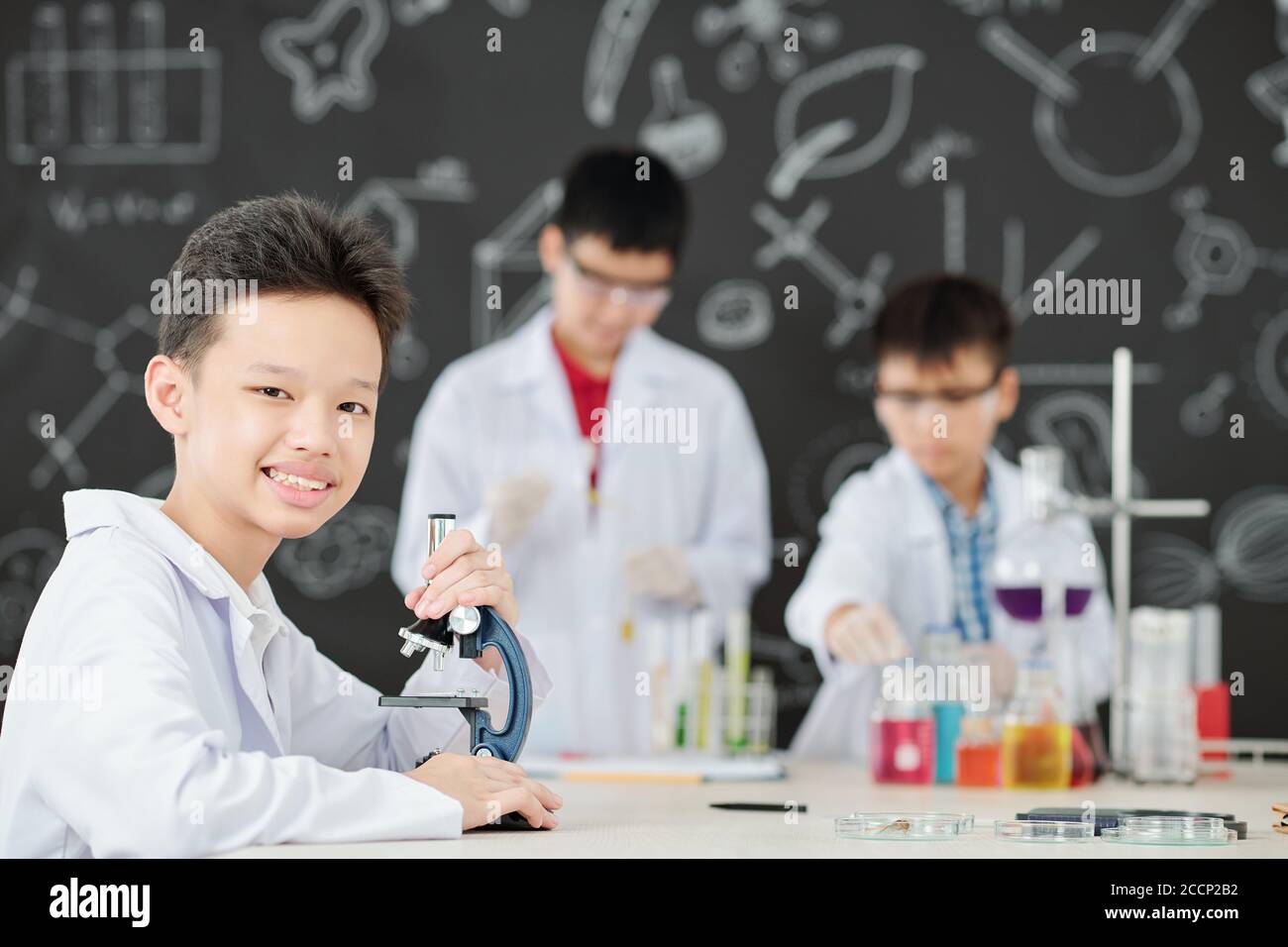 School student with microscope Stock Photo - Alamy