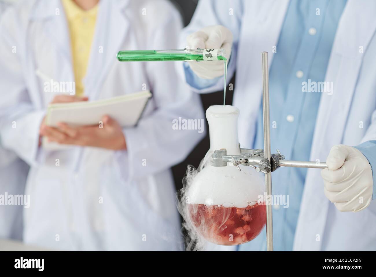 Student mixing reagents Stock Photo - Alamy