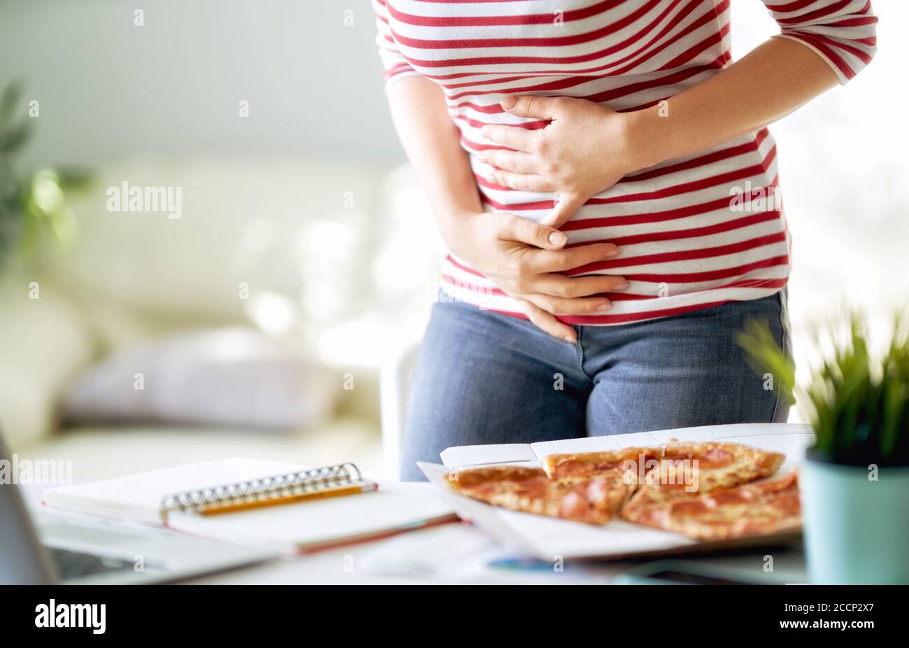 Unhealthy eating at desk hi-res stock photography and images - Alamy