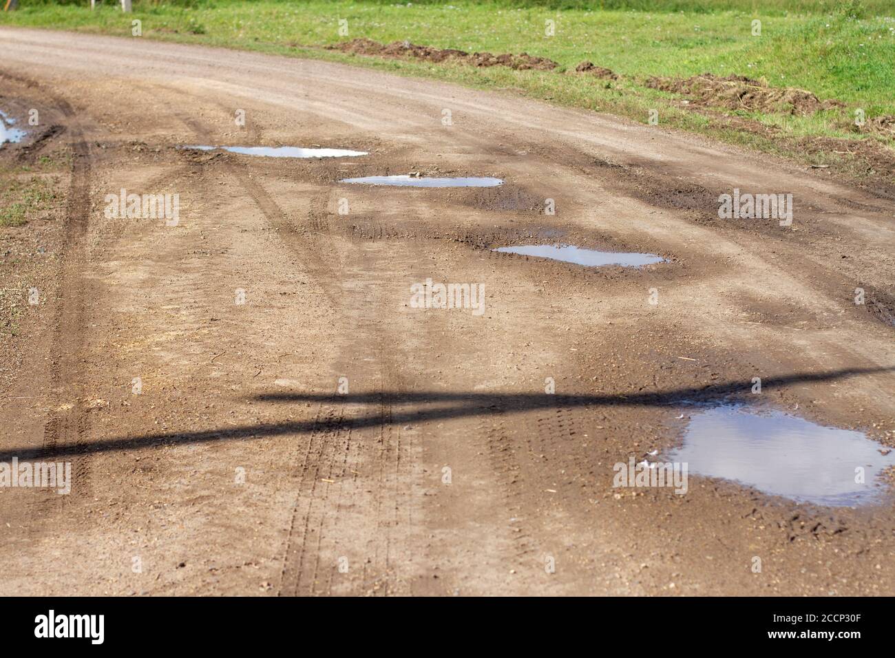 Rain falling into muddy puddle hi-res stock photography and images - Alamy