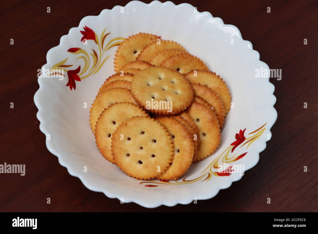 Salted crackers or biscuits in white bowl Stock Photo - Alamy