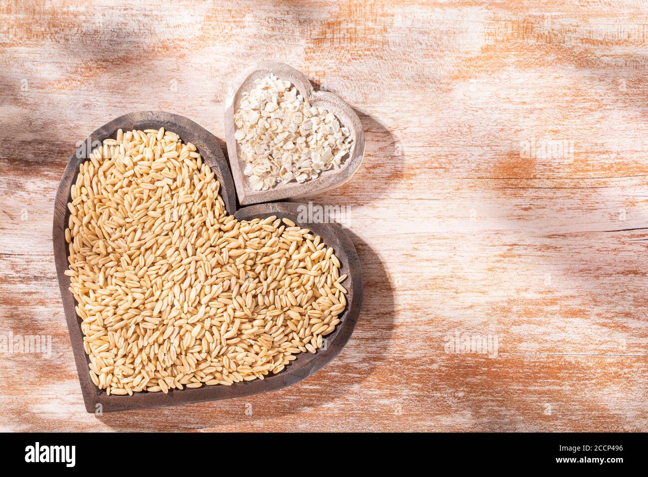 oat grains, flakes and flour on wood background Stock Photo - Alamy