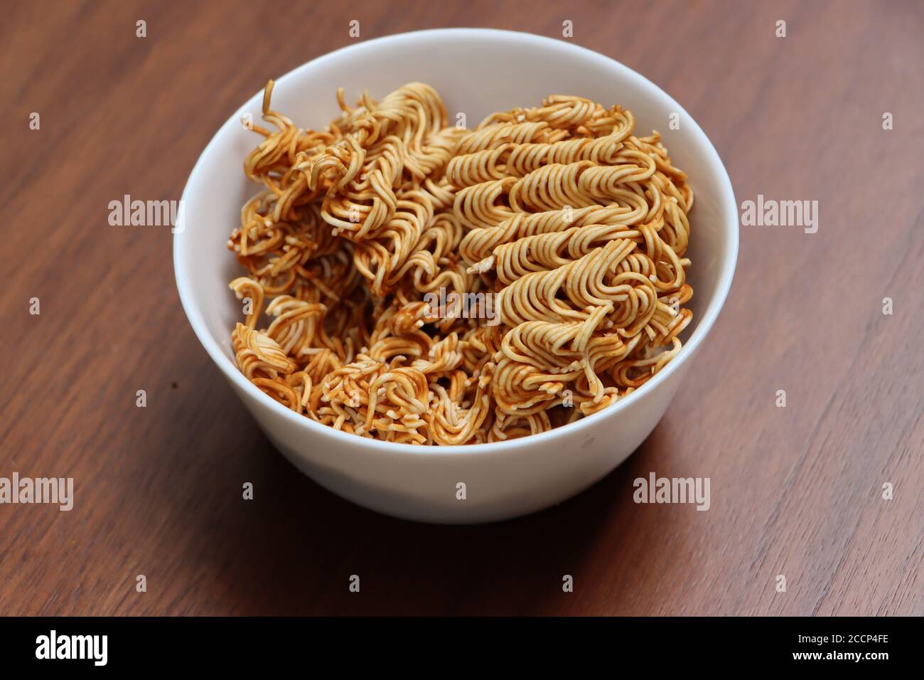Raw uncooked noodles with dried herbs and spices Stock Photo - Alamy