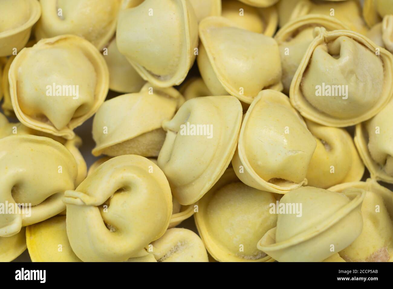 Raw dumplings texture background. Ready to cook Stock Photo - Alamy
