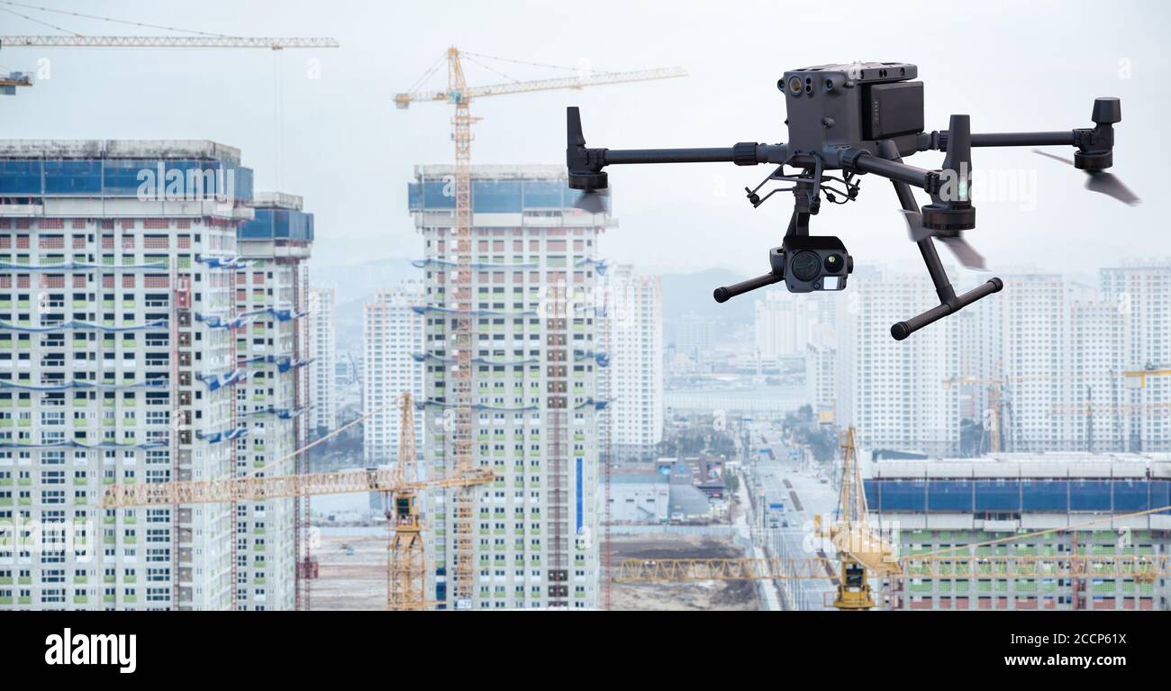 Drone on the background of a construction site Stock Photo - Alamy
