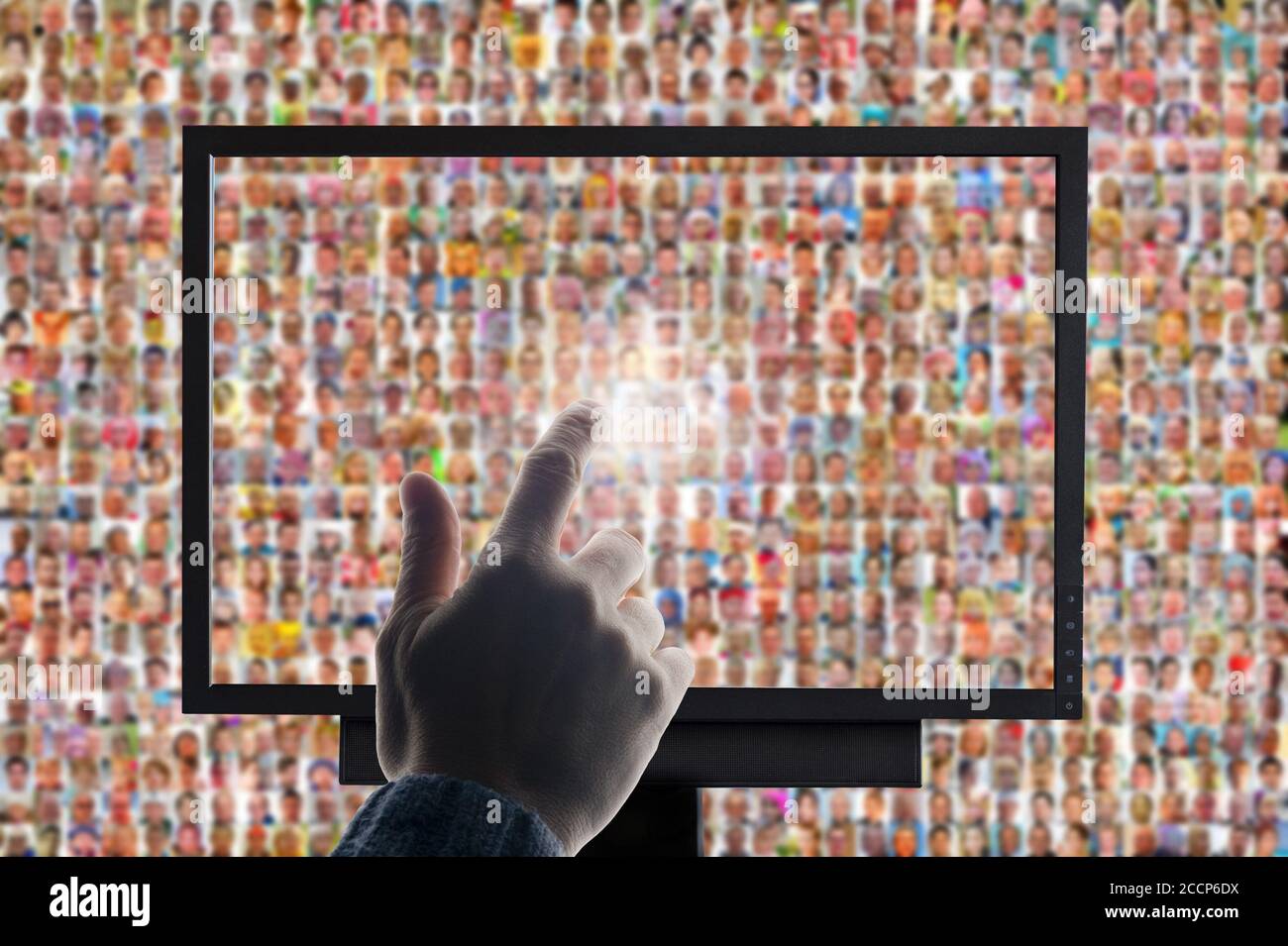 background of hundreds of people faces and computer screen with a hand ...
