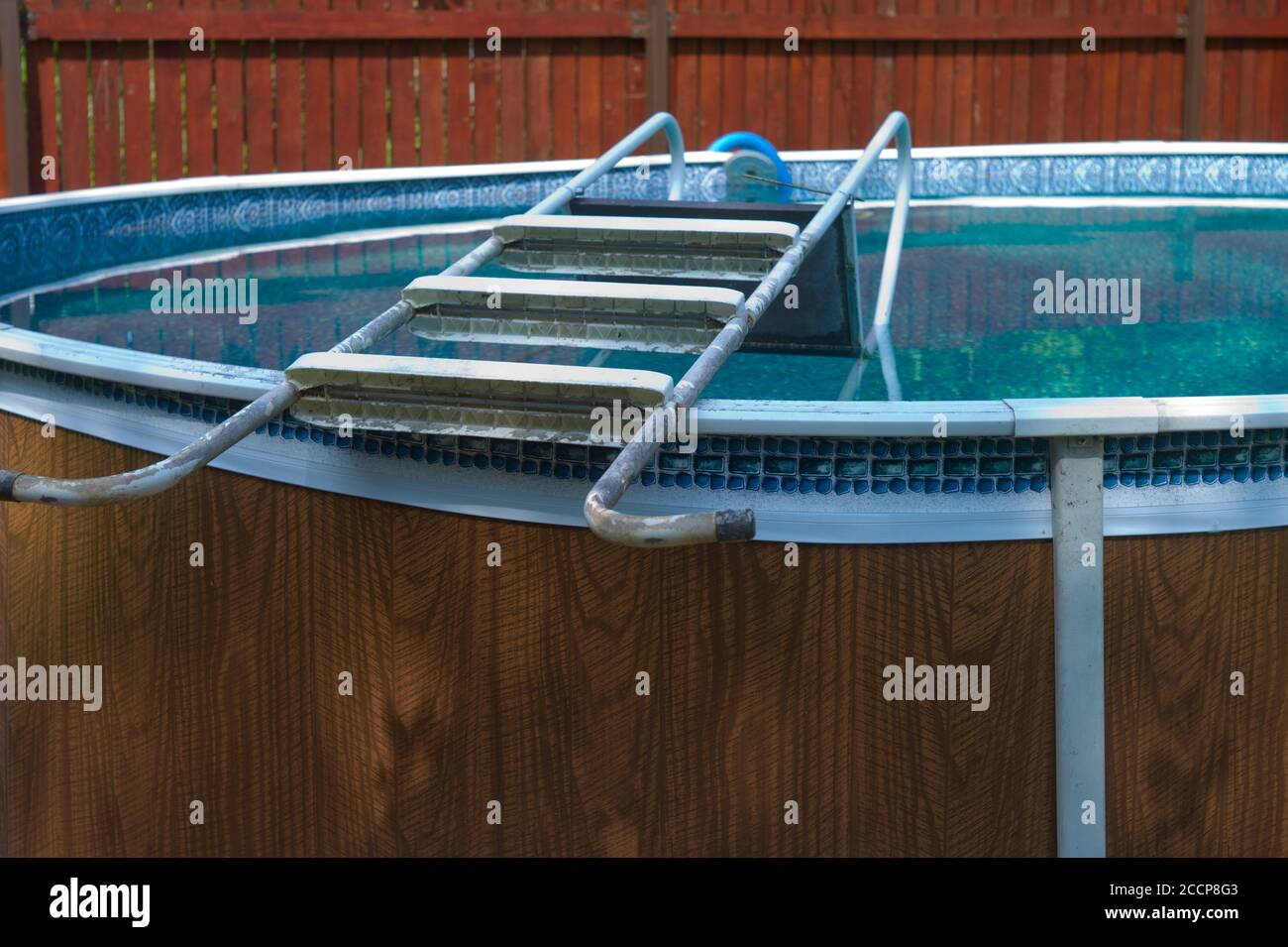 A ladder removed from an above ground pool seemingly closed for ...