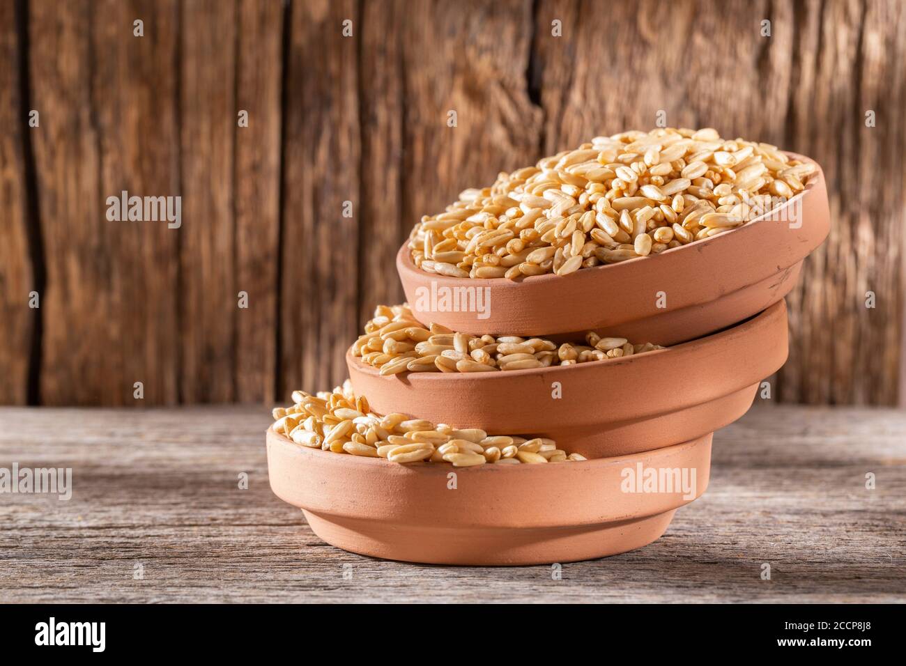 oat grains, flakes and flour on wood background Stock Photo - Alamy