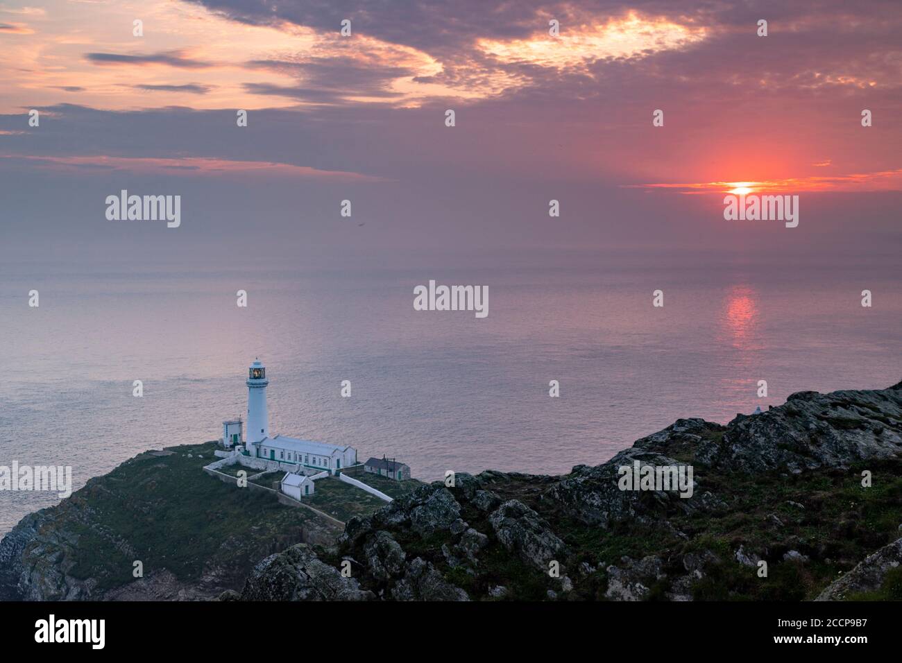 Sunset over South Stack lighthouse, Anglesey, North Wales Stock Photo ...