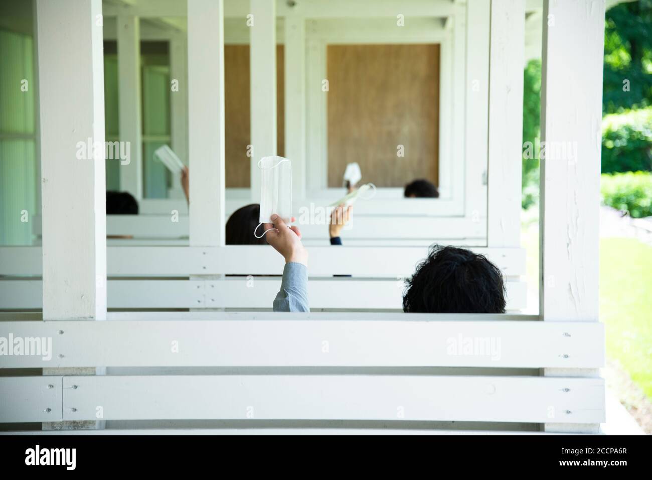 Men and Woman Raising Face Mask Stock Photo - Alamy