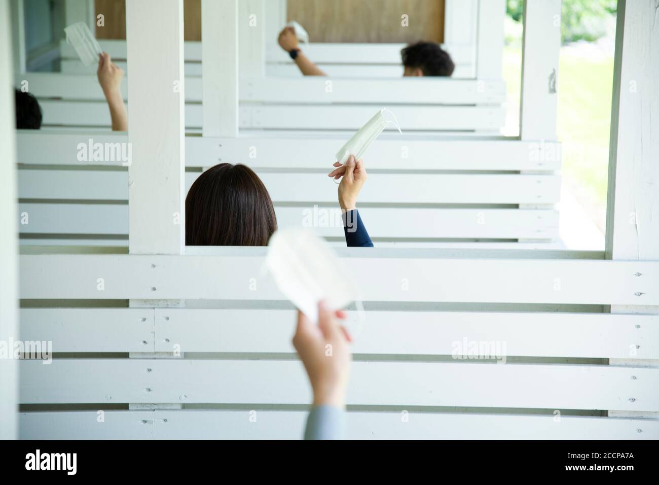 Men and Woman Raising Face Mask Stock Photo - Alamy
